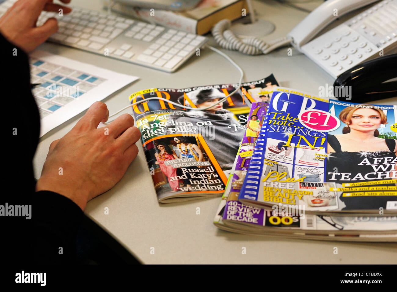 Grazia magazine on desk Stock Photo - Alamy