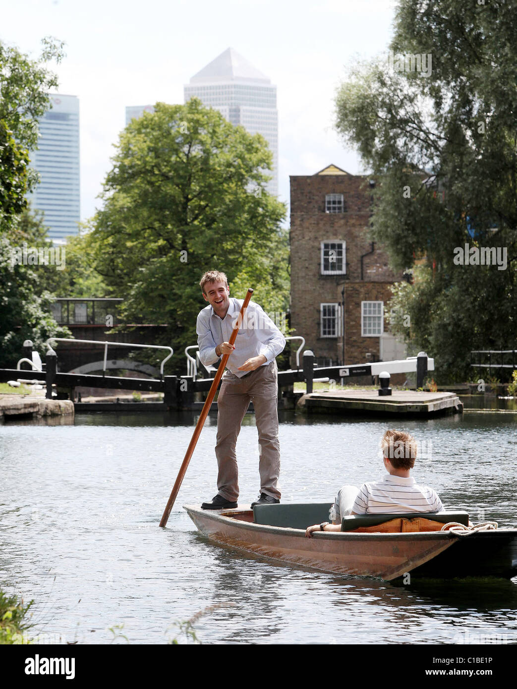 A man turns his hand to a spot of Punting on the Regents Canal London ...