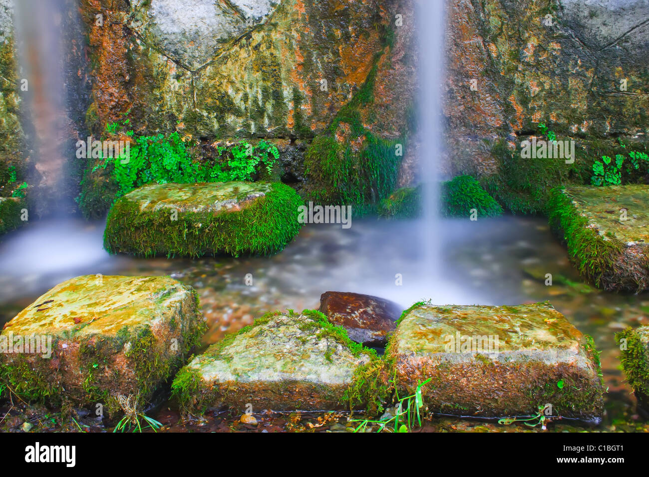 Water spring in Ancient park in Greece Stock Photo - Alamy