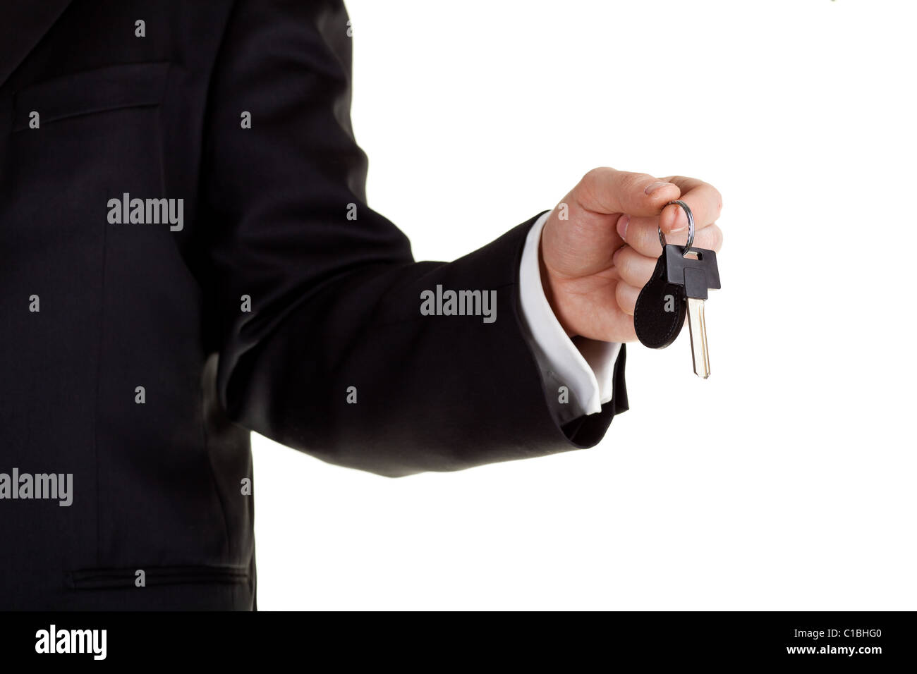 Car keys in hand, isolated on white Stock Photo - Alamy