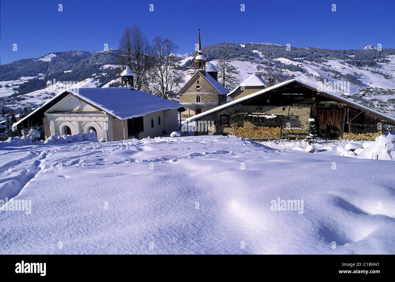 France, Haute Savoie, Megeve, a snow covered landscape with a farm ...