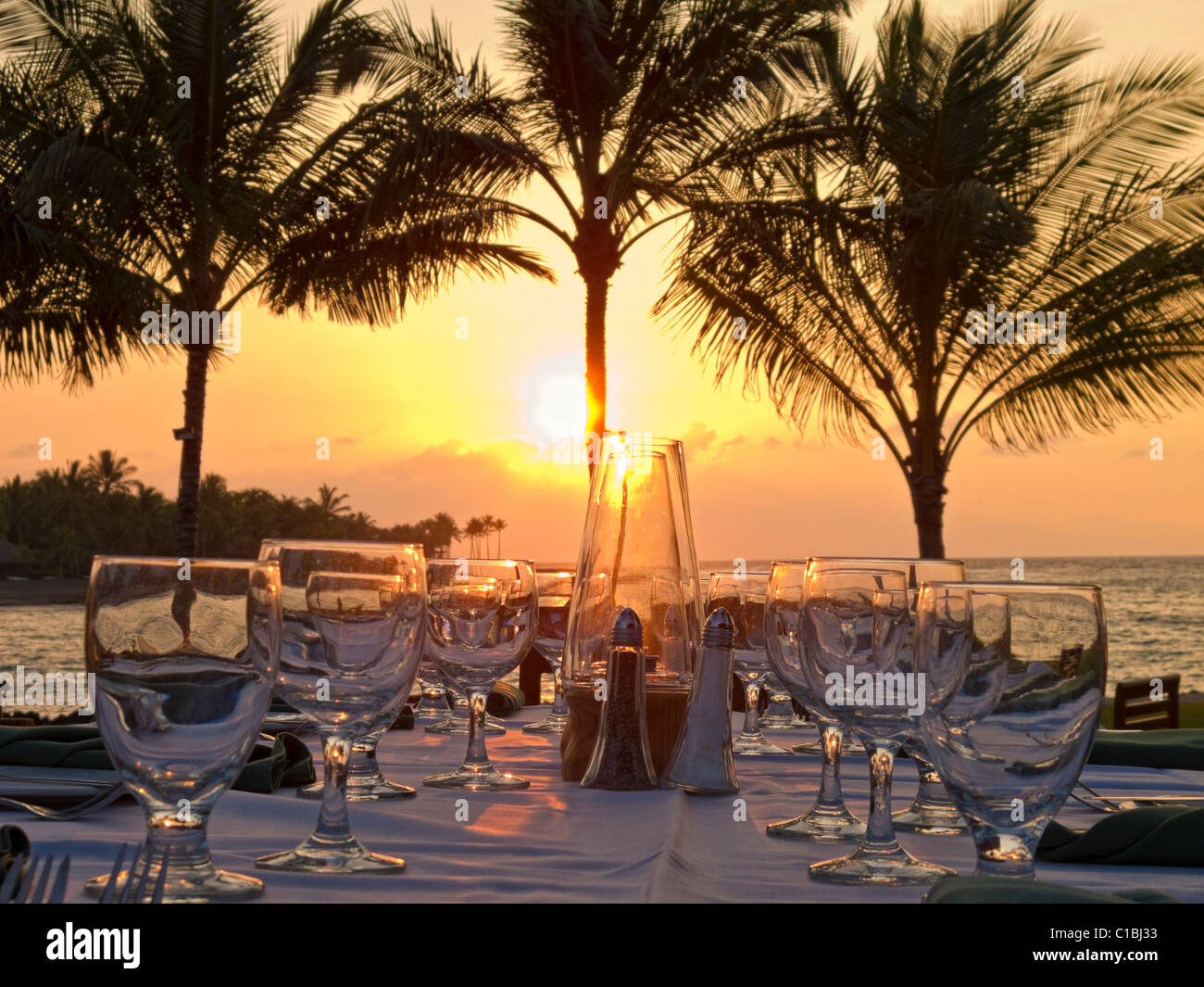 Sunset table setting in Kona,Hawaii Stock Photo - Alamy