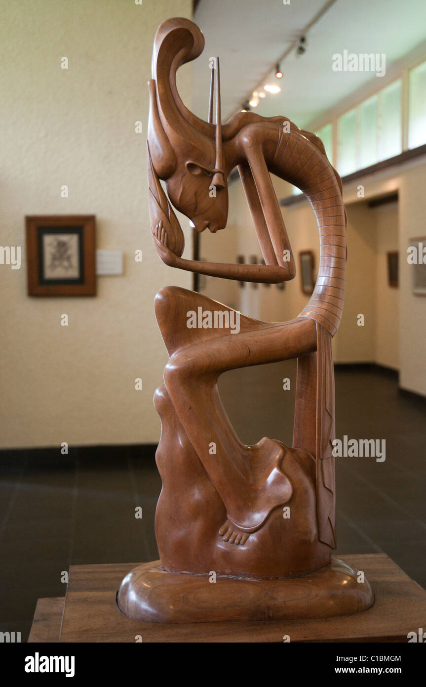 Carving of Dewi Sri the rice goddess by the woodcarver Ketut Djedeng in ...