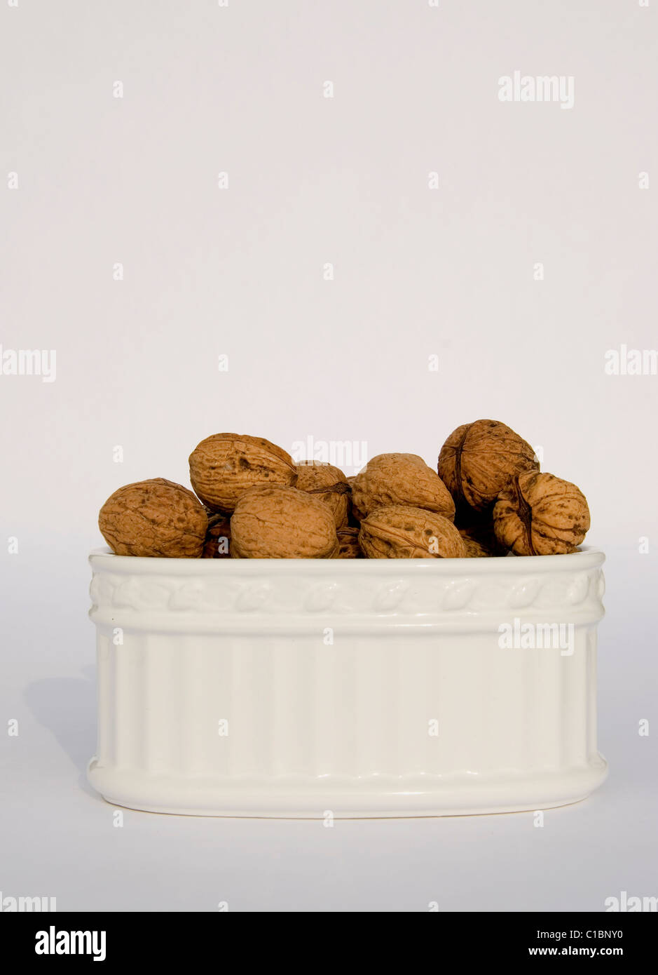 Box of different sizes walnuts isolated on a white background Stock ...