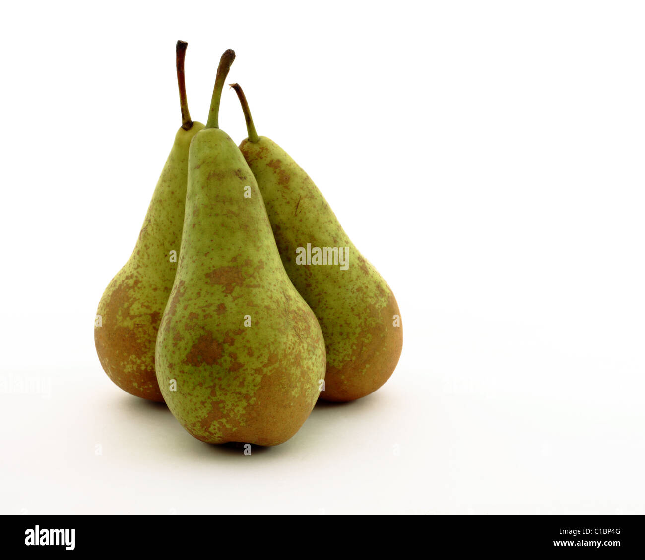 Three Pears in a group Stock Photo - Alamy