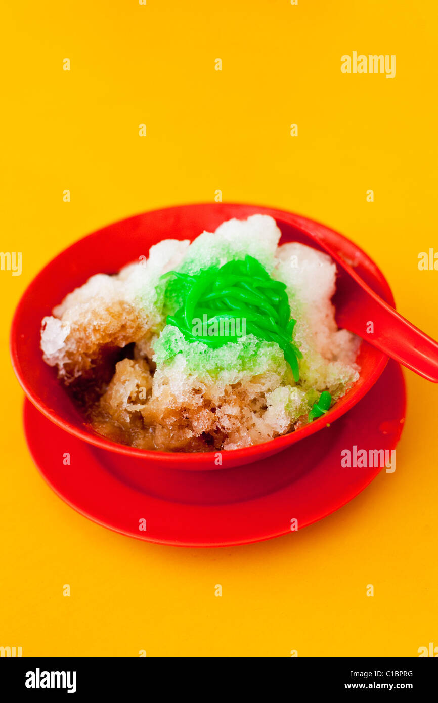 Es cendol (or ice cendol) - a popular shaved ice dessert made with ...