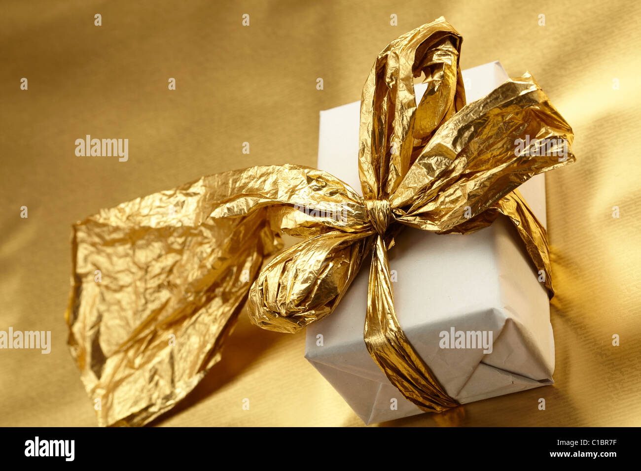 gift box with gold ribbon Stock Photo - Alamy