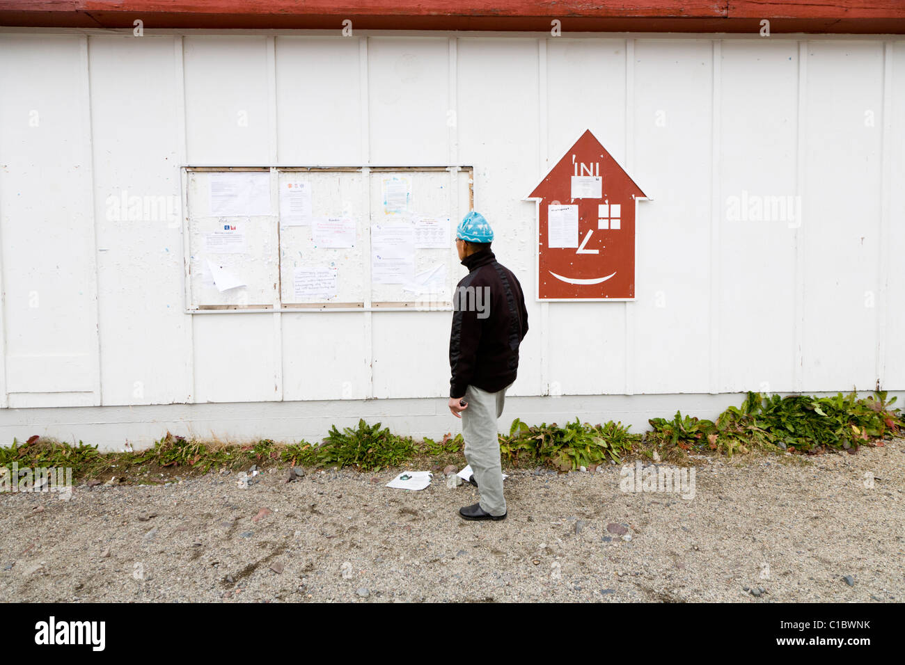 Man reading a community notice board, Narsaq, South Greenland Stock ...