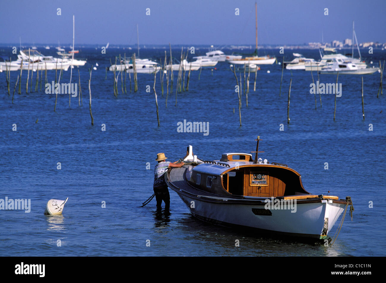 France, Gironde, Bassin d'Arcachon, a fisherman is getting his pinasse ...