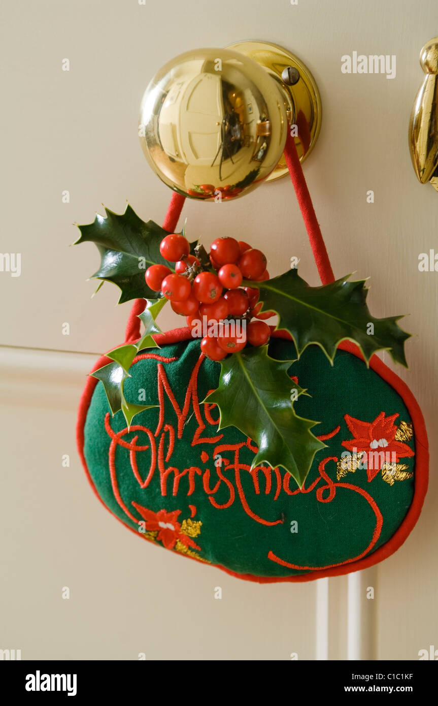 Festive decoration hanging from a door handle Stock Photo - Alamy