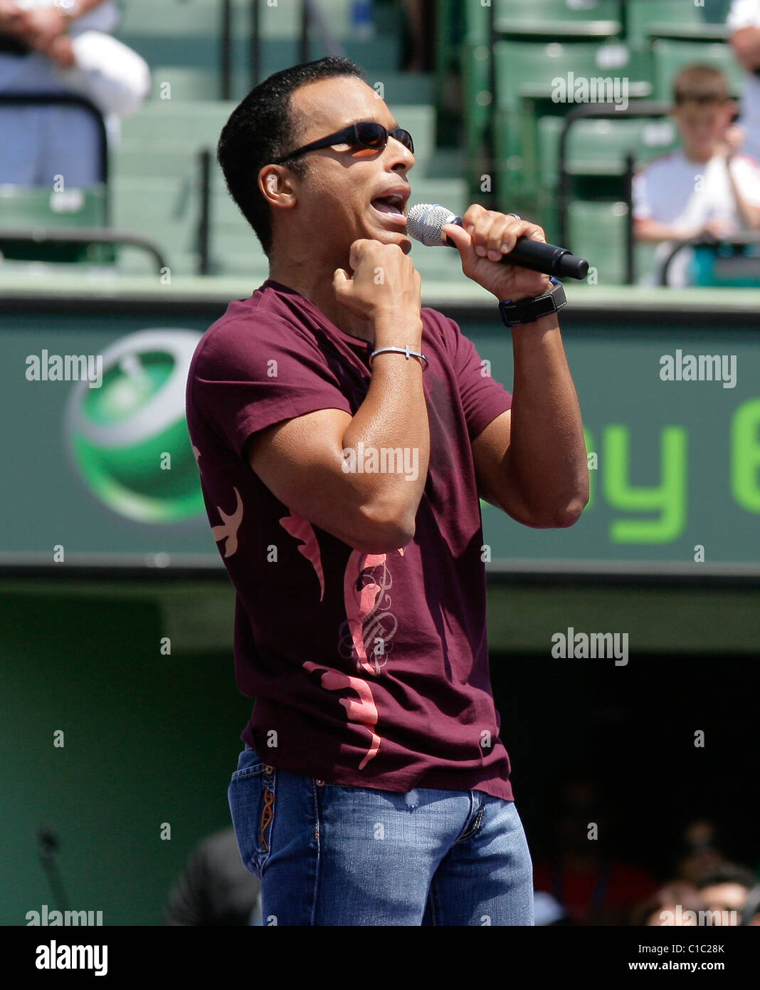 Singer Jon Secada performs the National Anthem before the men's final ...
