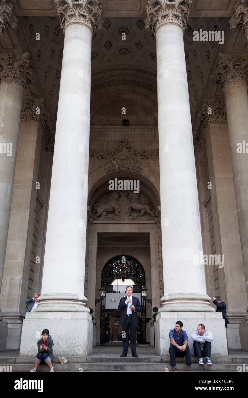 People by the columns outside the Royal Exchange in the City of London ...