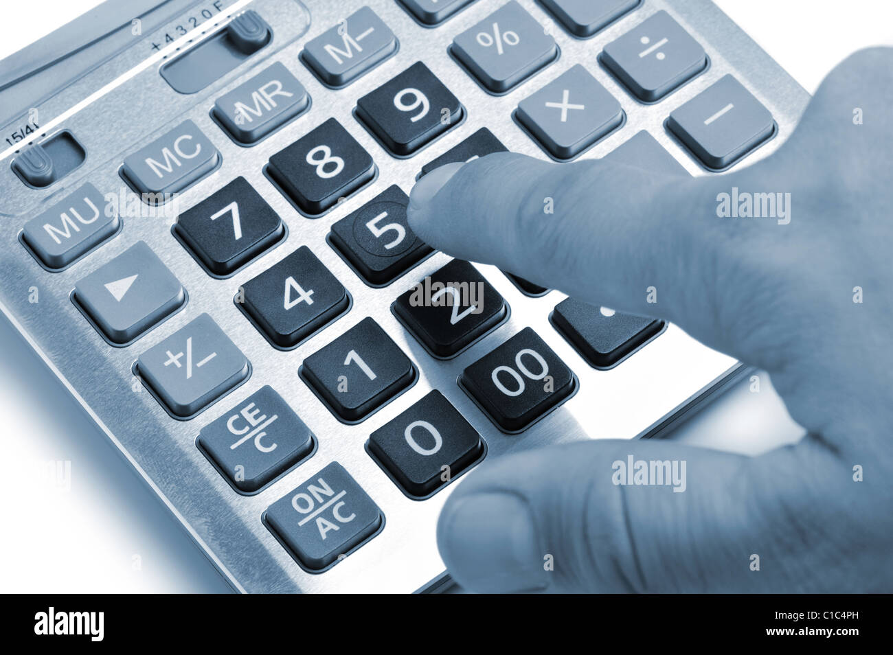 The calculator and a hand of the man. Pressing of a key of the ...