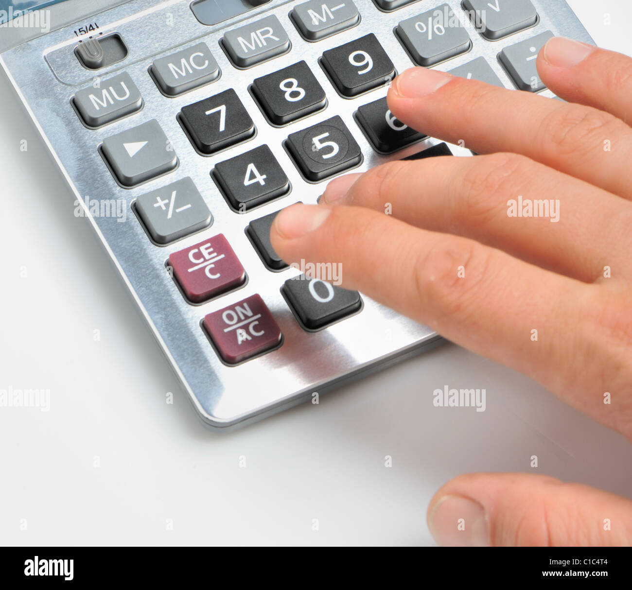 The calculator and a hand of the man. Pressing of a key of the ...