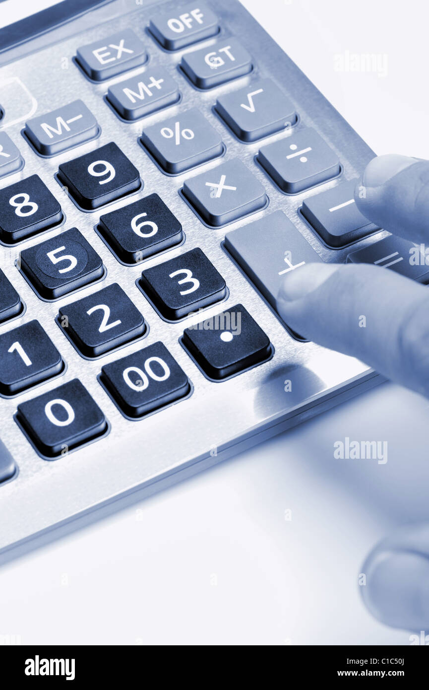 The calculator and a hand of the man. Pressing of a key of the ...