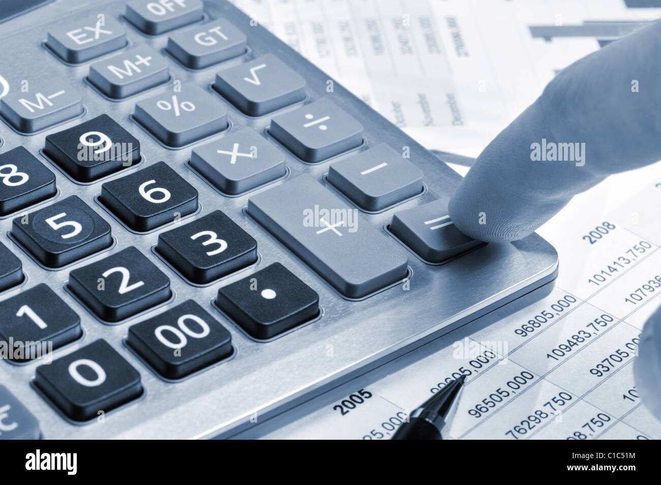 The calculator and a hand of the man. Pressing of a key of the ...