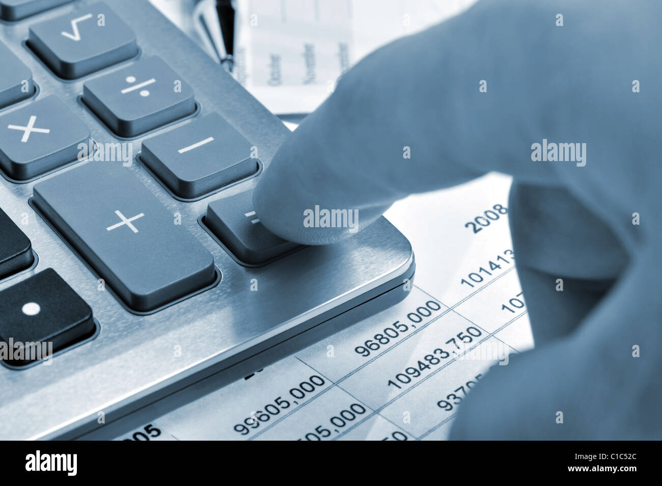 The calculator and a hand of the man. Pressing of a key of the ...