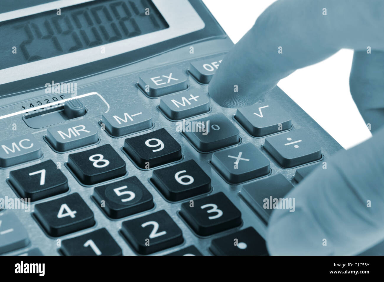 The calculator and a hand of the man. Pressing of a key of the ...