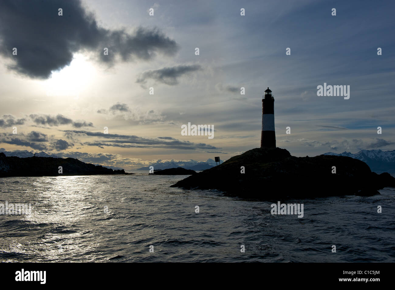 Light house on reef in the middle of an ocean Stock Photo - Alamy
