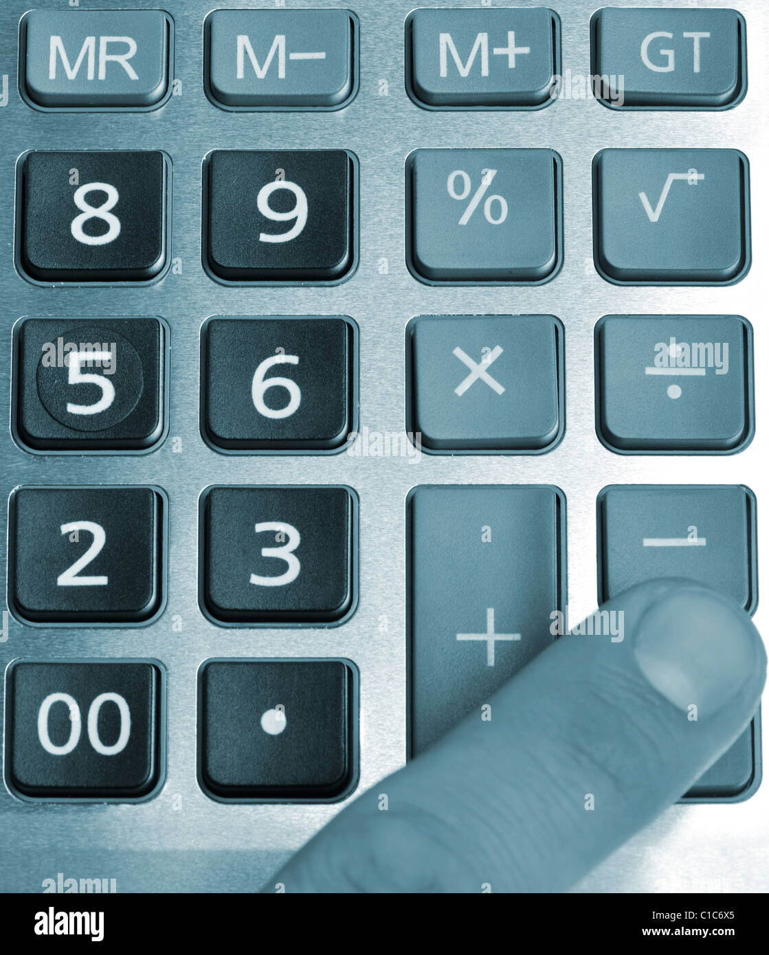 The calculator and a hand of the man. Pressing of a key of the ...