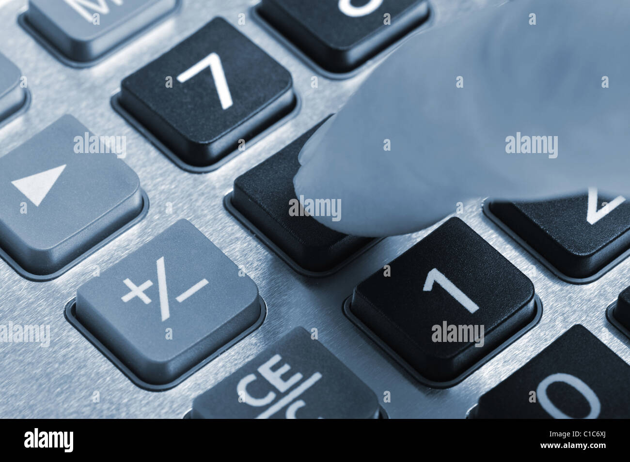The calculator and a hand of the man. Pressing of a key of the ...