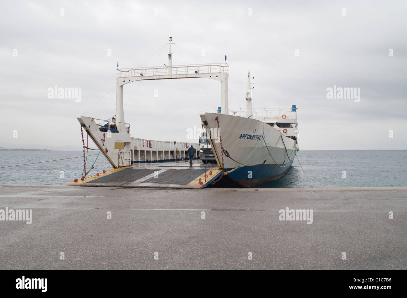 The ferries still load and unload as usual beneath the Rio-Antirion ...