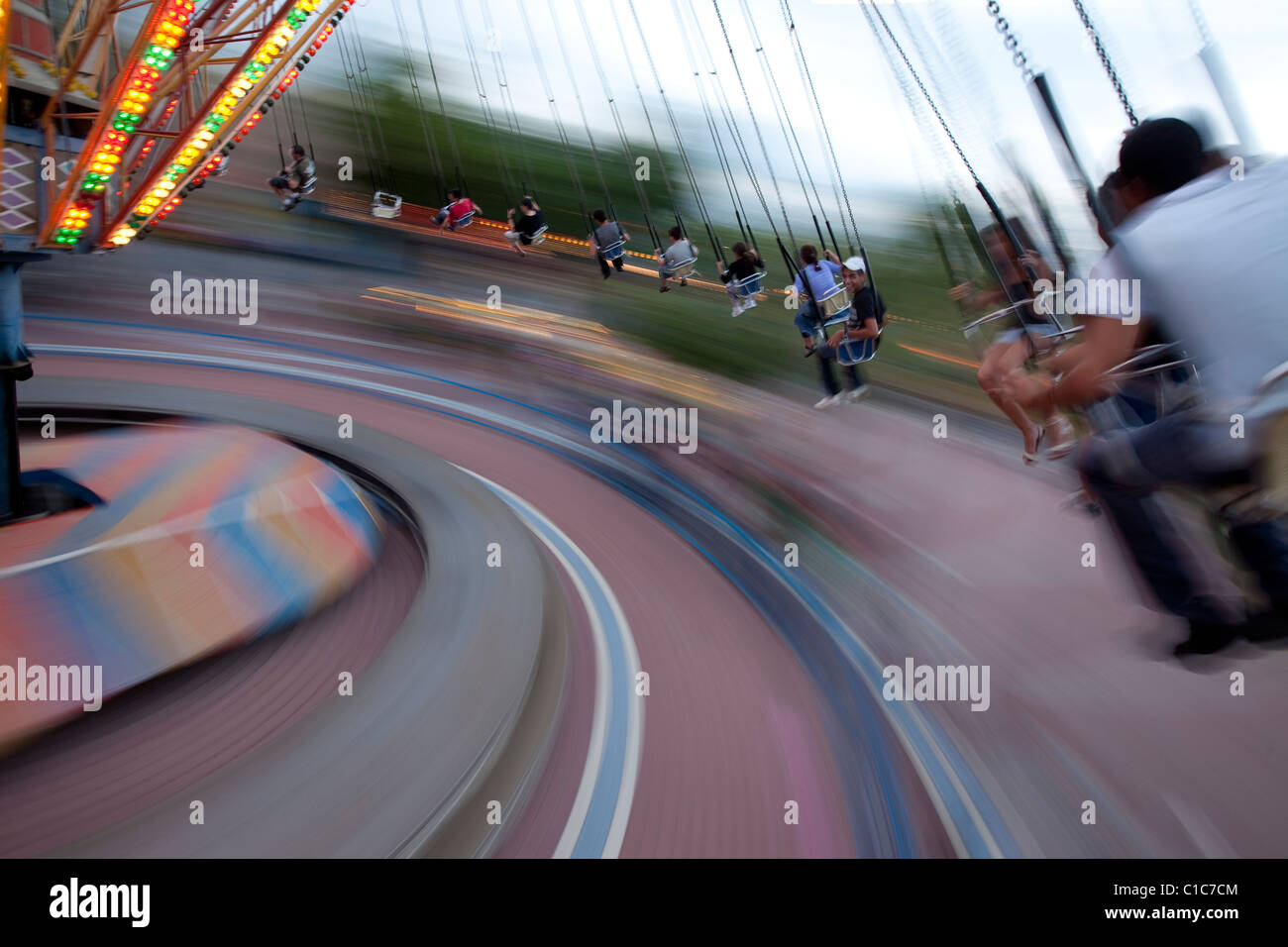 Moving carousel in Amusement Park Stock Photo - Alamy