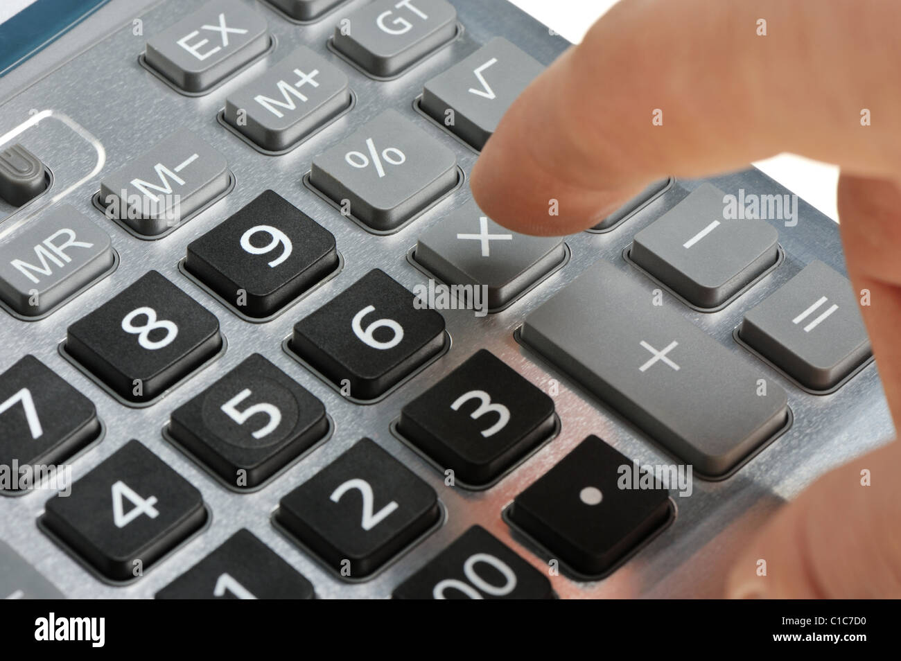 The calculator and a hand of the man. Pressing of a key of the ...