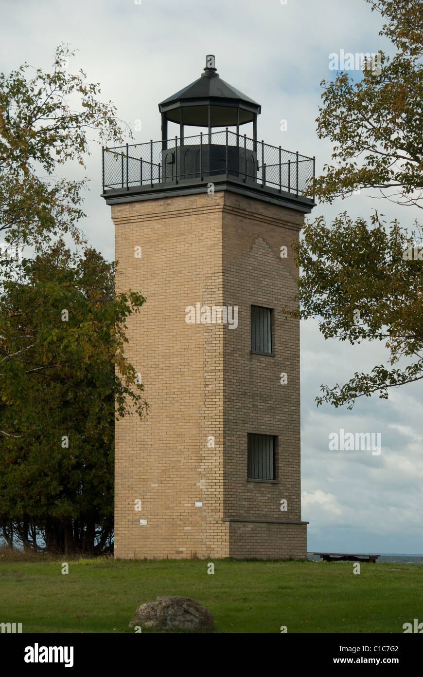 Peninsula Point Lighthouse is located on northern Lake Michigan south ...