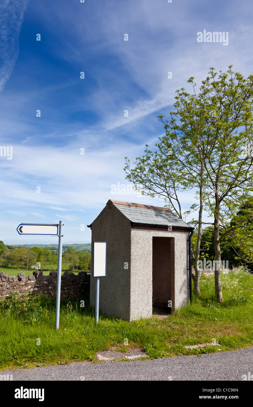 Small rural countryside bus stop and shelter with blank signs, England ...