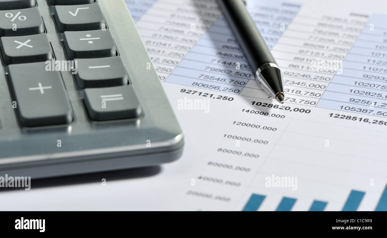 The calculator and the financial report. A workplace of the businessman ...