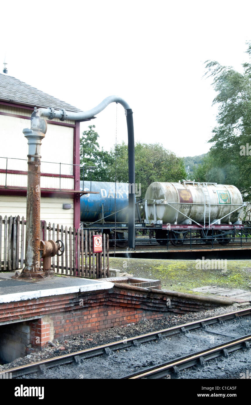 Water tank to fill steam train up Stock Photo - Alamy