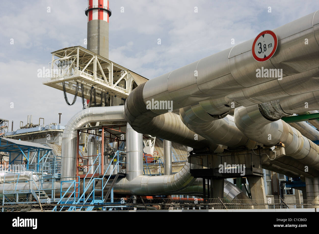 Pipes and tubes and chimney at a powerplant Stock Photo - Alamy
