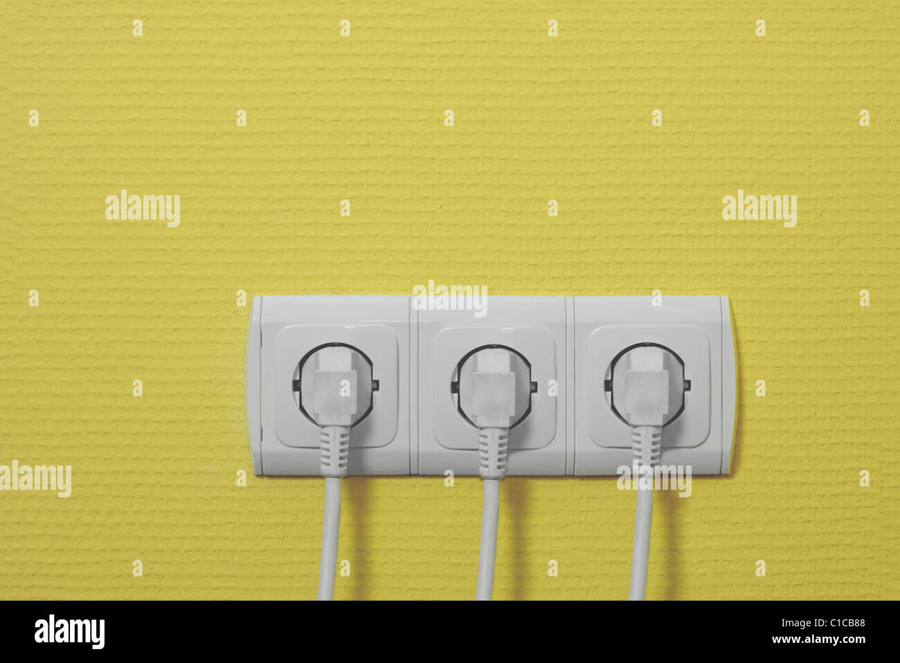 Three electric outlets with cables connected Stock Photo - Alamy