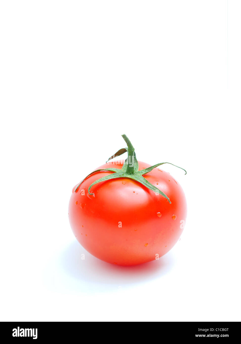Perfect red tomato isolated on white Stock Photo - Alamy