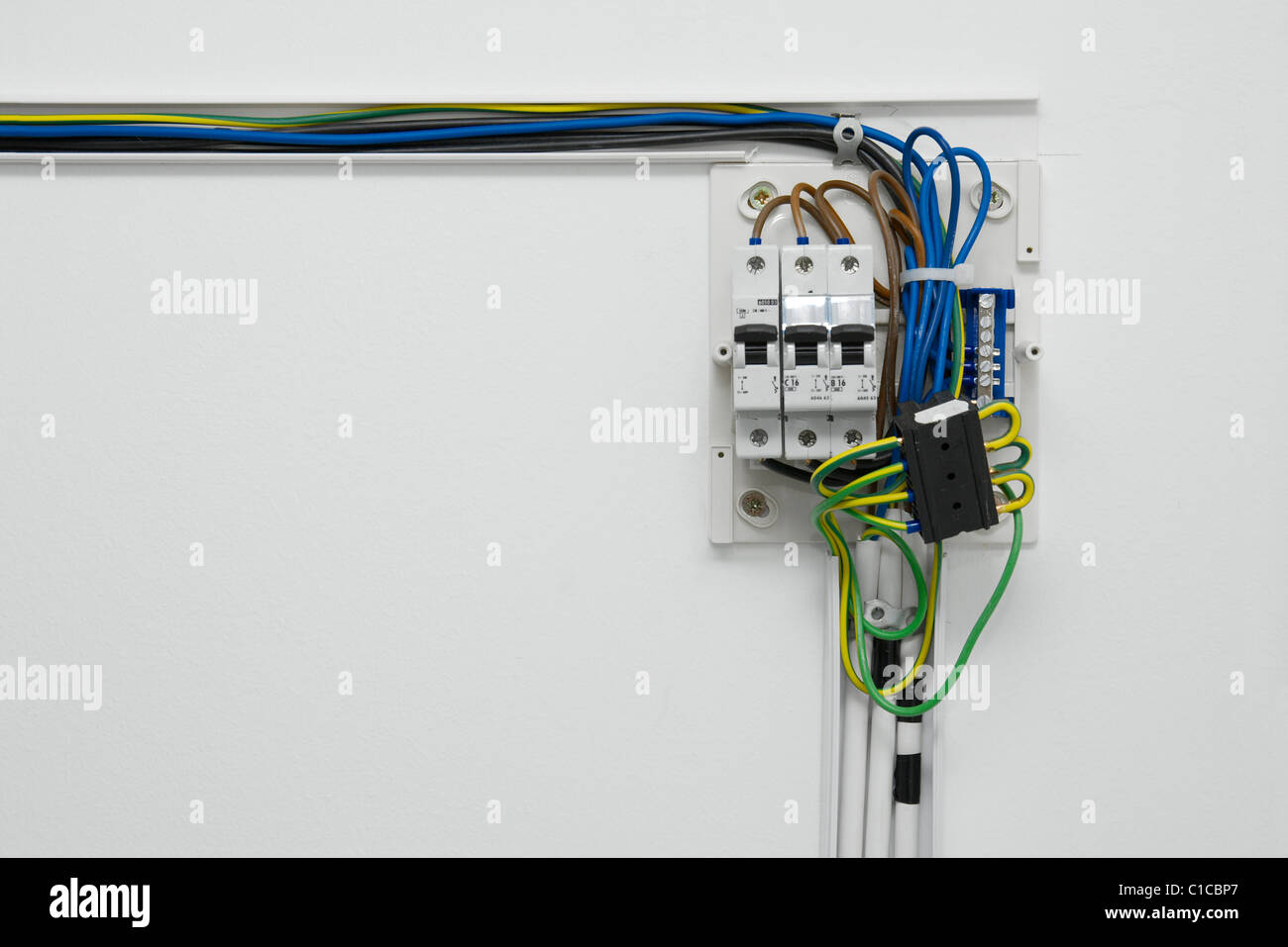 Electric wiring on white wall Stock Photo - Alamy