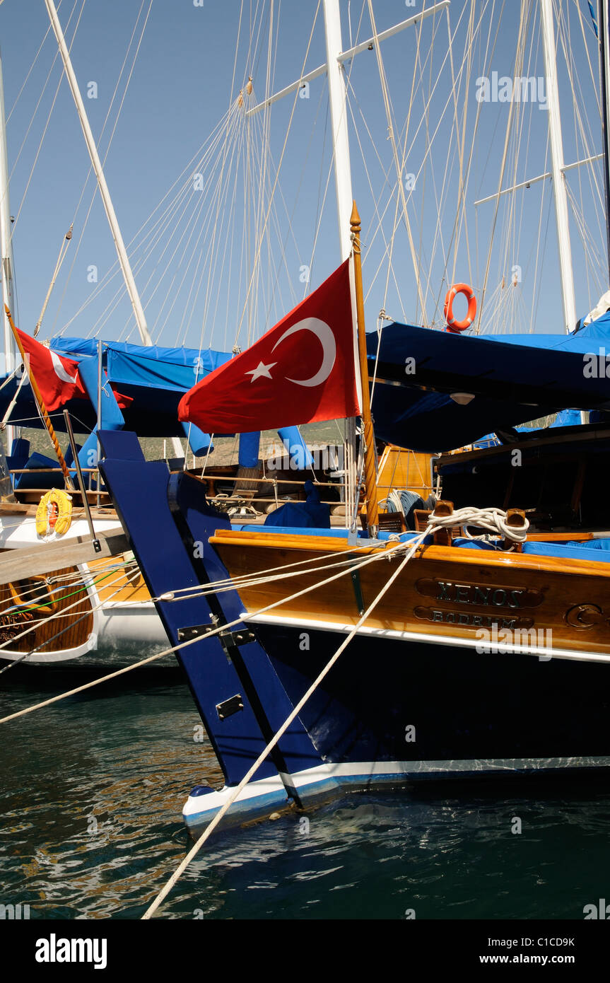 Bodrum harbour the stern of a traditional wooden Gulet boat flying the ...