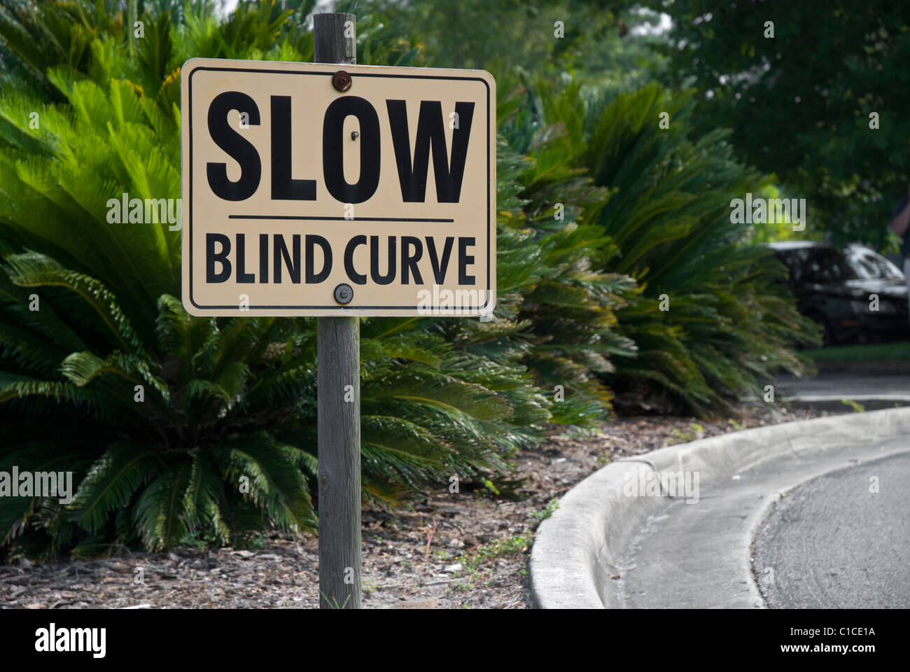 slow blind curve sign Stock Photo - Alamy