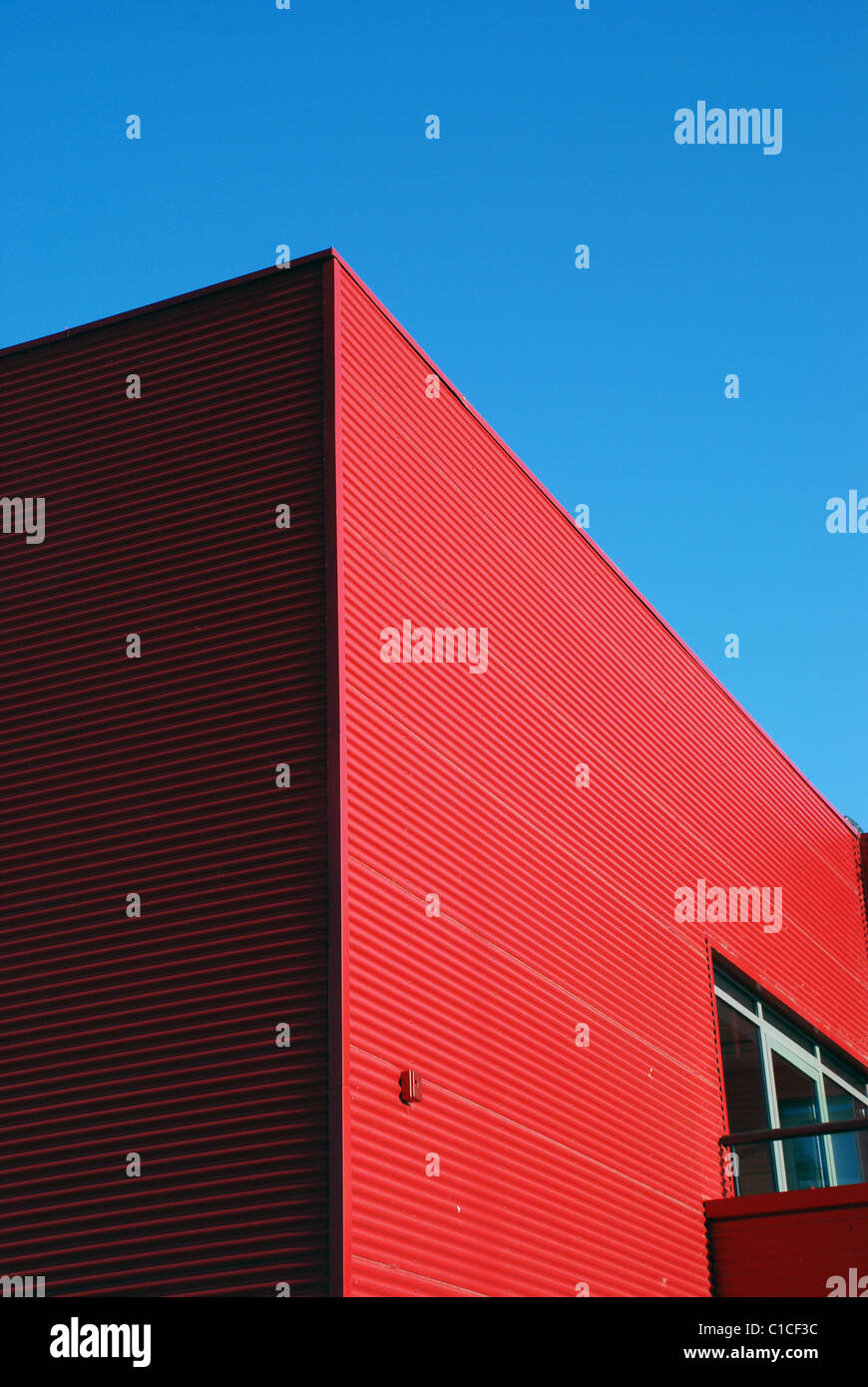 Corner of house which walls made of red tin Stock Photo - Alamy