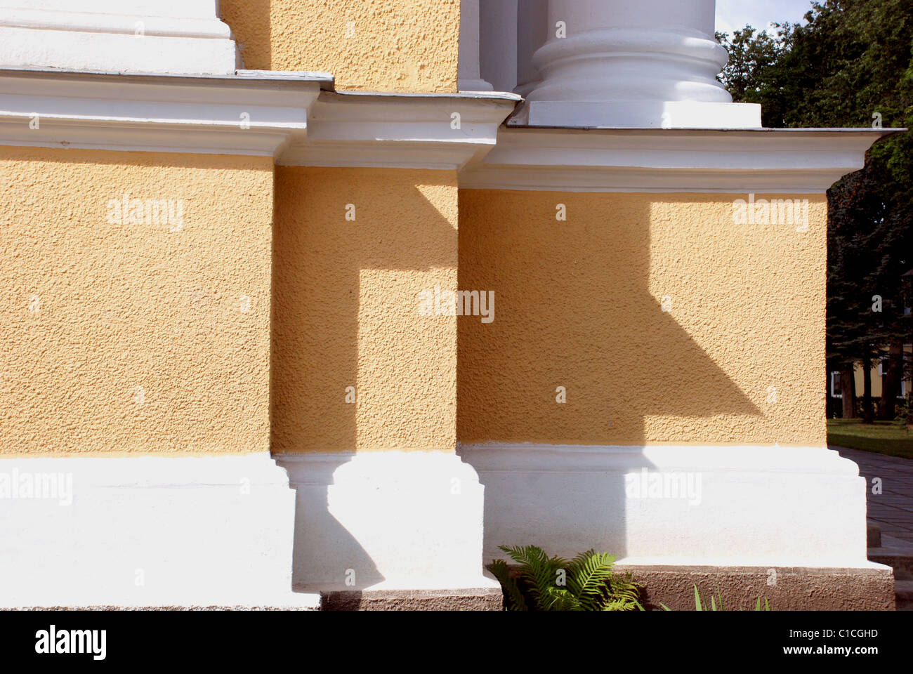 Architecture - yellow building fragment with white columns Stock Photo ...