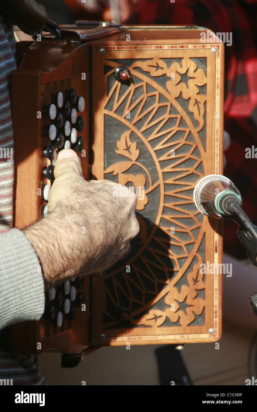 detail of person with musical instrument outdoors in sun Stock Photo ...