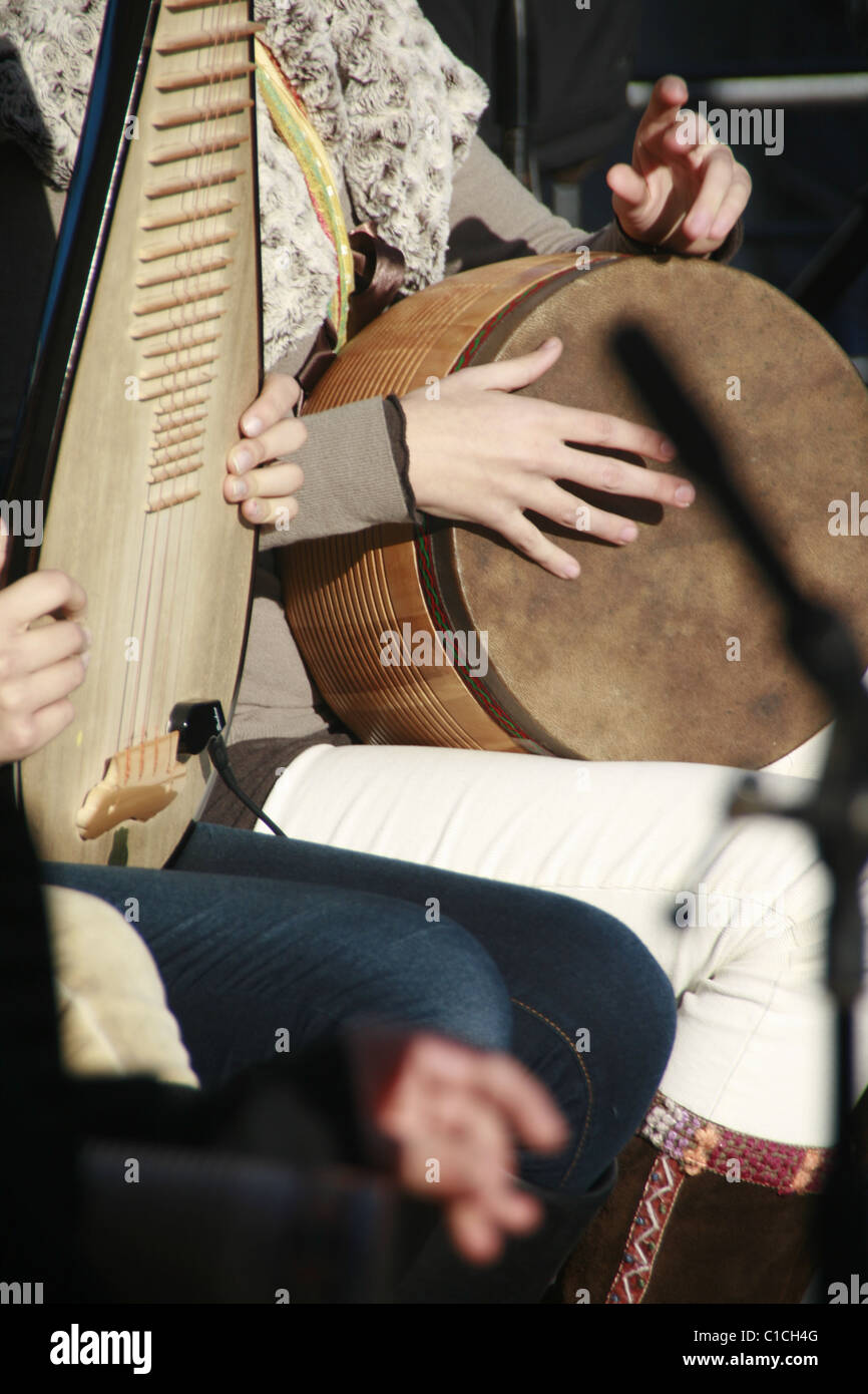 detail of person with musical instrument outdoors in sun Stock Photo ...