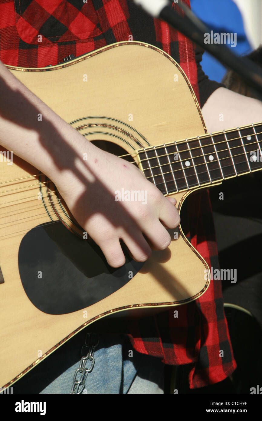 detail of person with musical instrument outdoors in sun Stock Photo ...