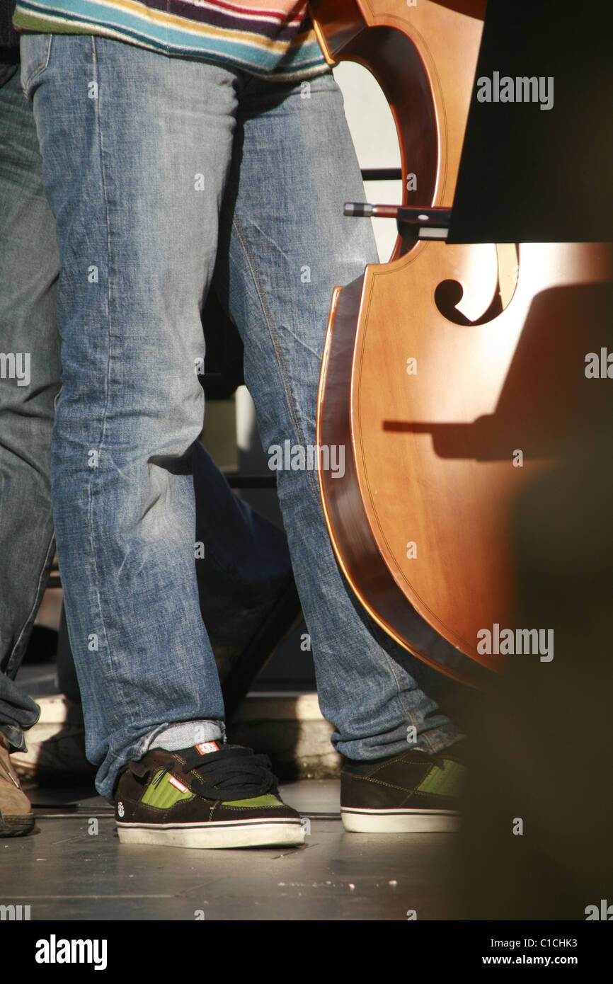 detail of person with musical instrument outdoors in sun Stock Photo ...