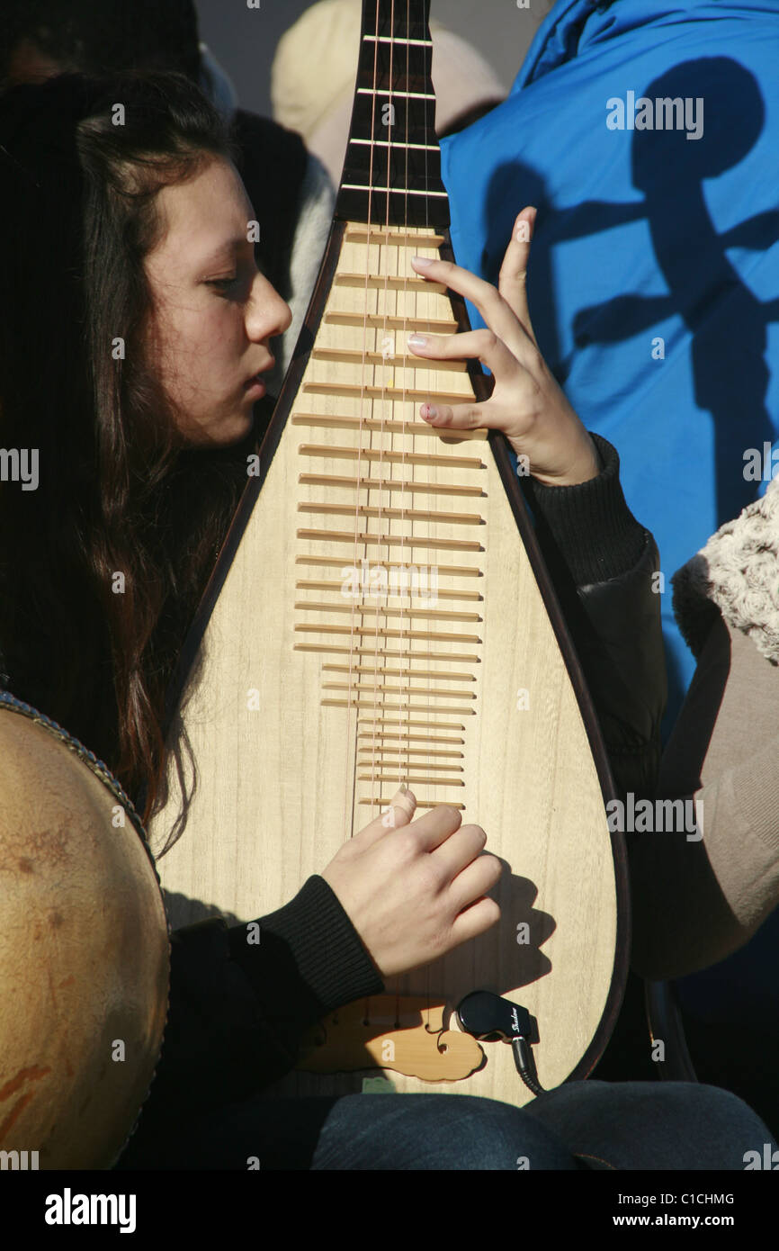 detail of person with musical instrument outdoors in sun Stock Photo ...