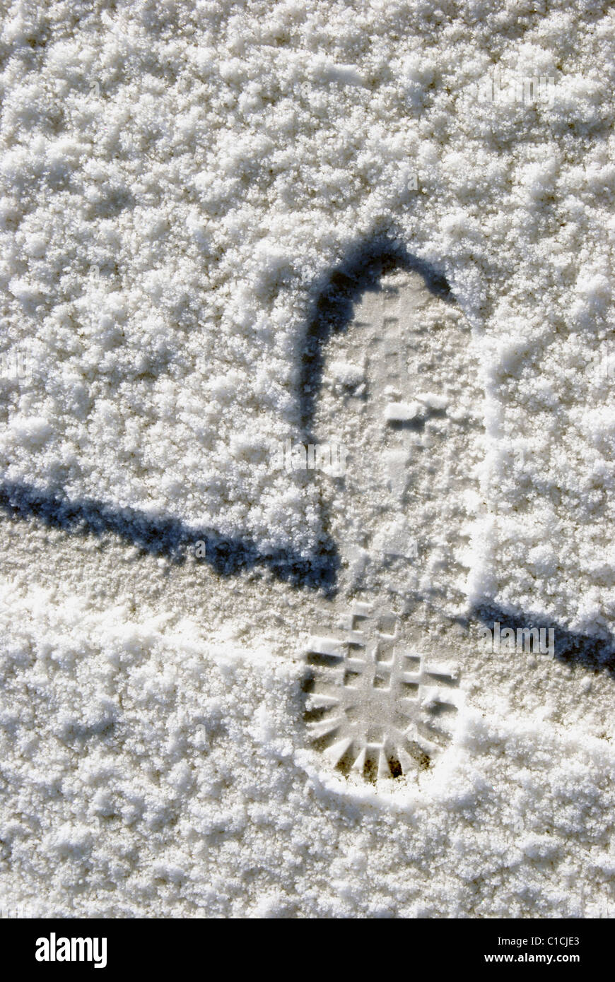 Human foot and bicycle wheel imprint in the snow Stock Photo - Alamy