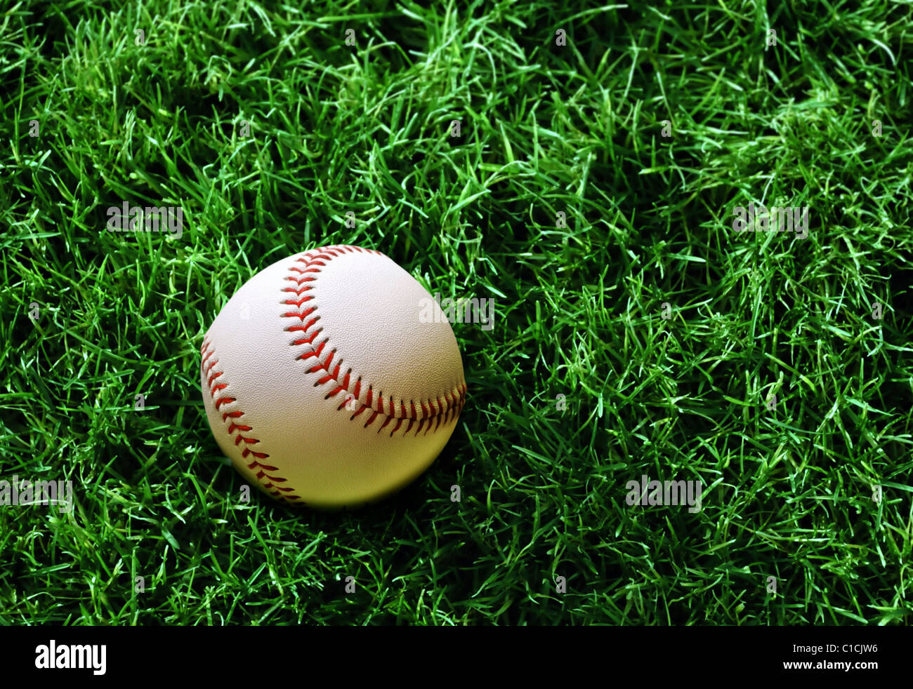 white baseball on green grass sports course Stock Photo - Alamy