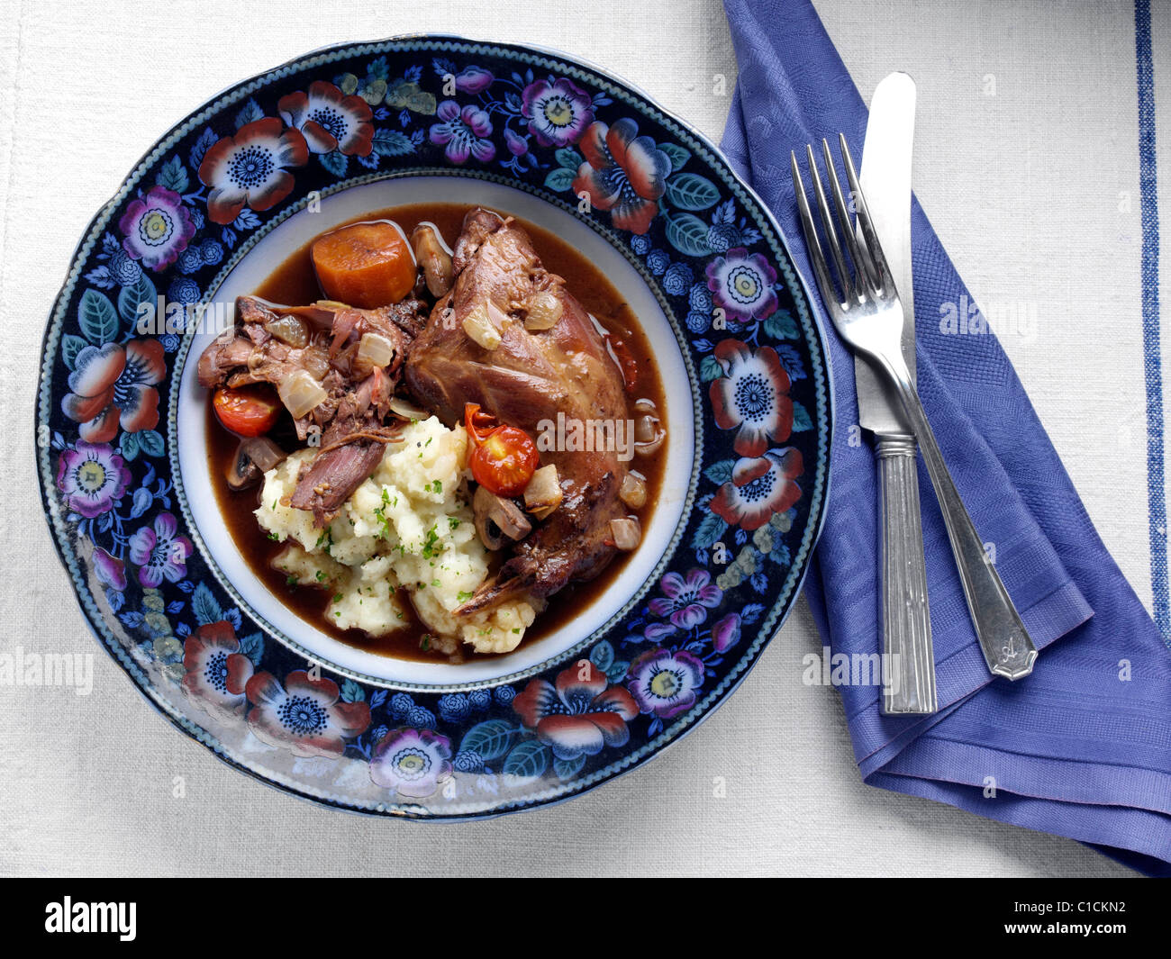 An antique plate of rabbit stew Stock Photo - Alamy