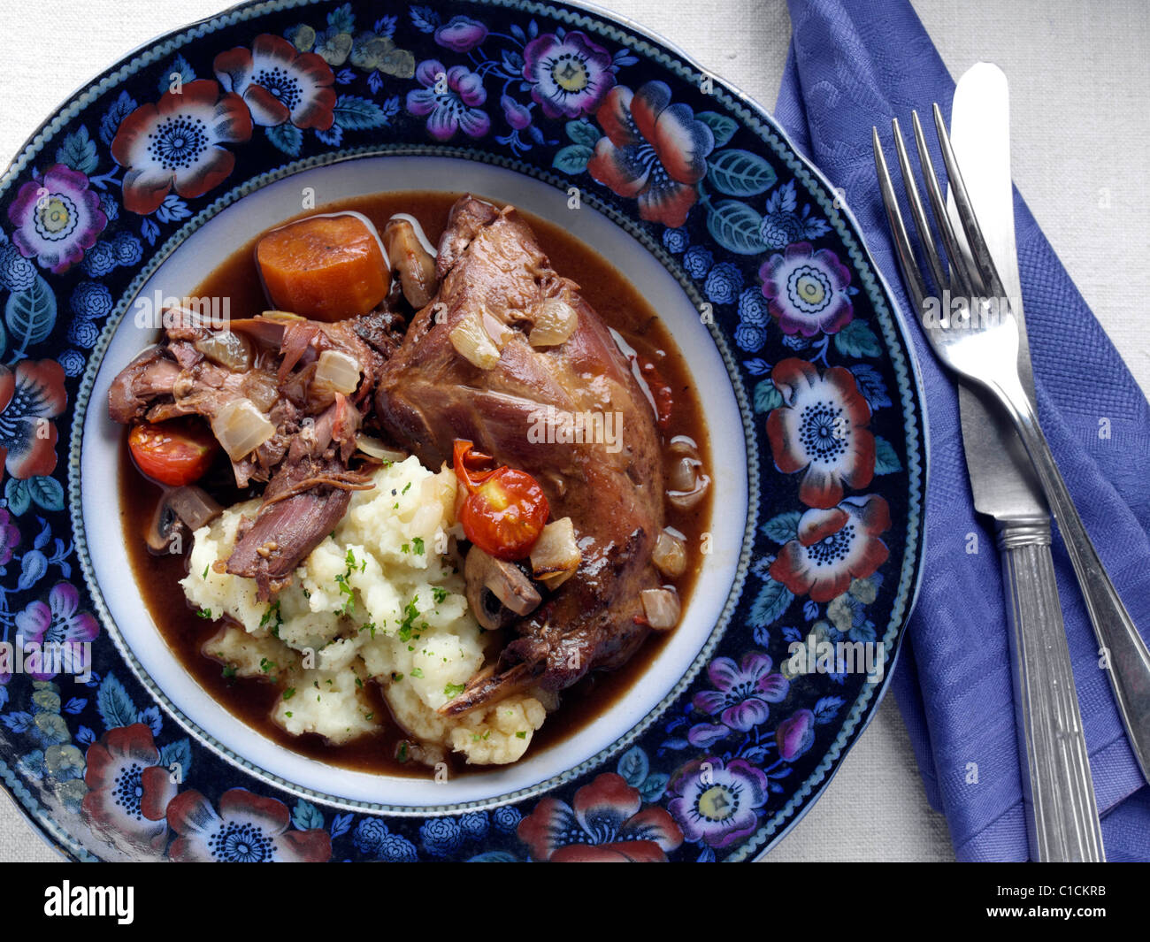 An antique plate of rabbit stew Stock Photo - Alamy