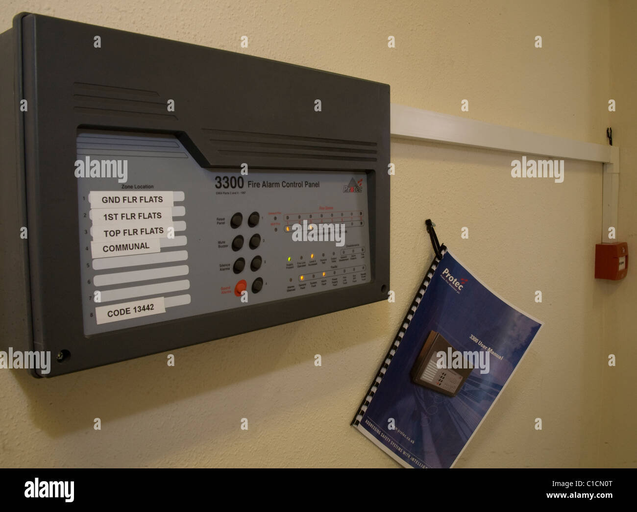 Fire alarm panel and fire alarm callpoint in communal housing block ...